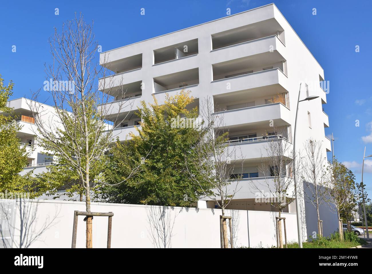 New six-storey, white painted, apartment building, in a residential ...
