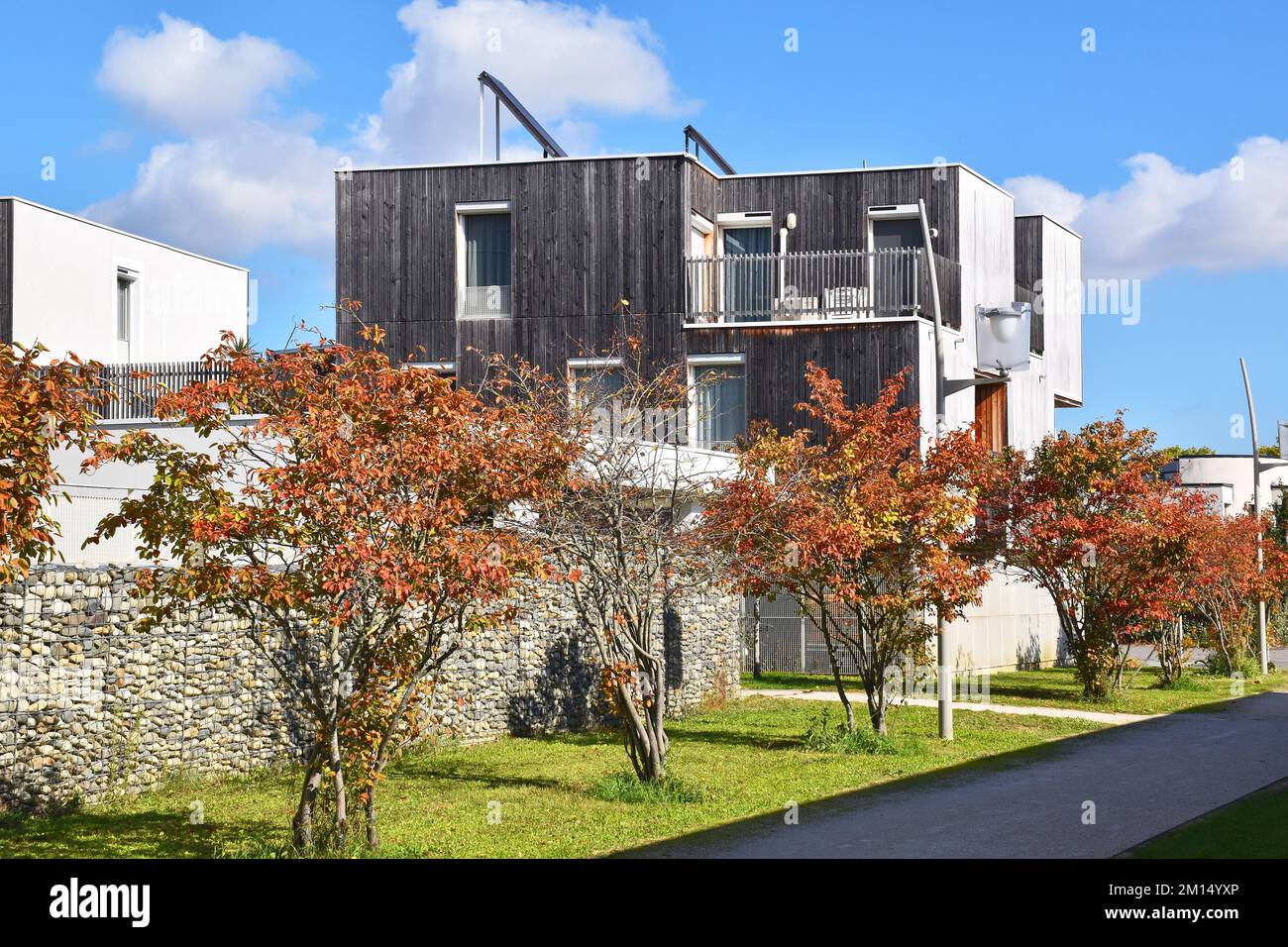New, timber-clad two and three-storey houses in the residential part of ...