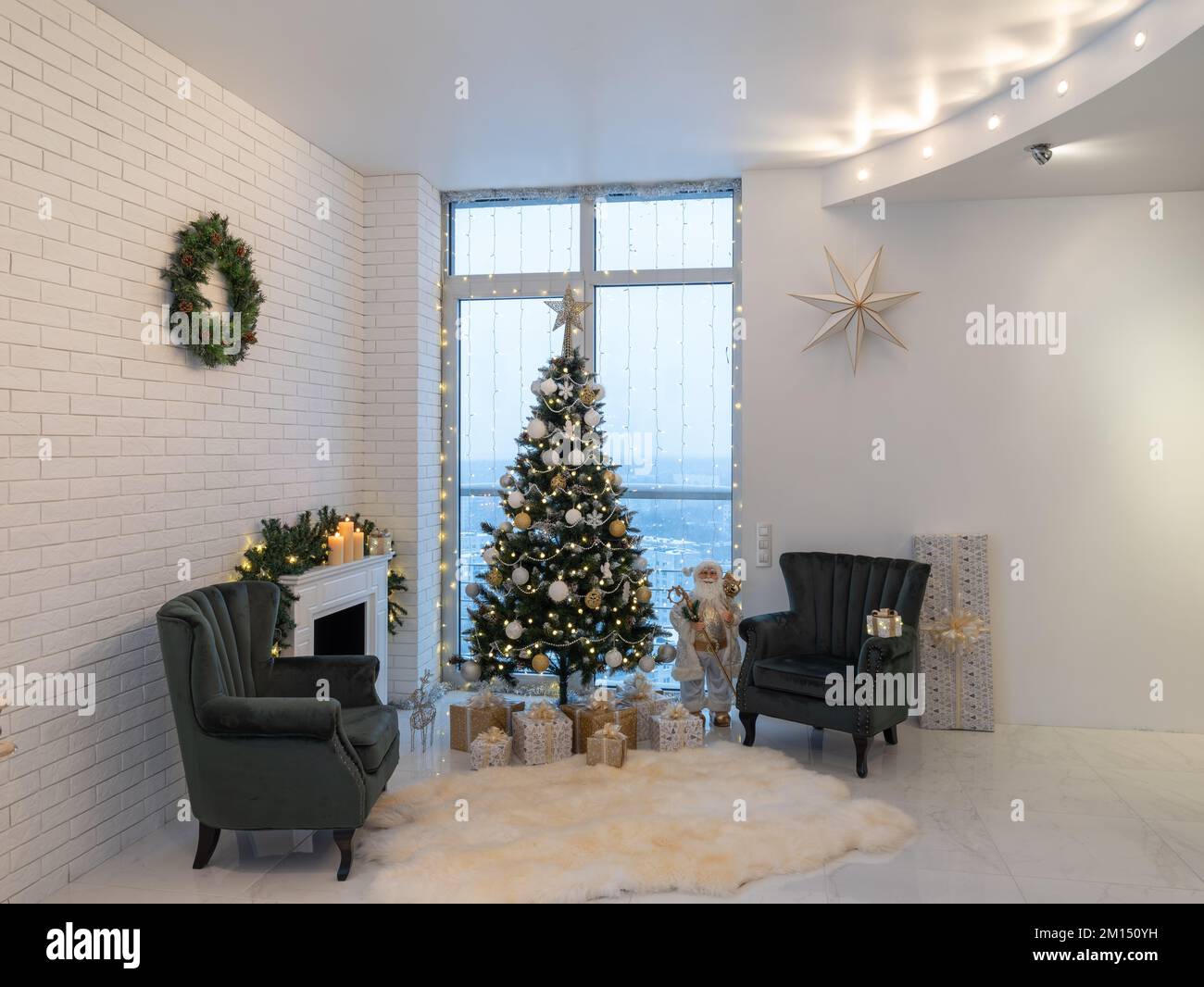 Christmas tree, gifts. Decorated fireplace. Wreath on wall. Interior ...