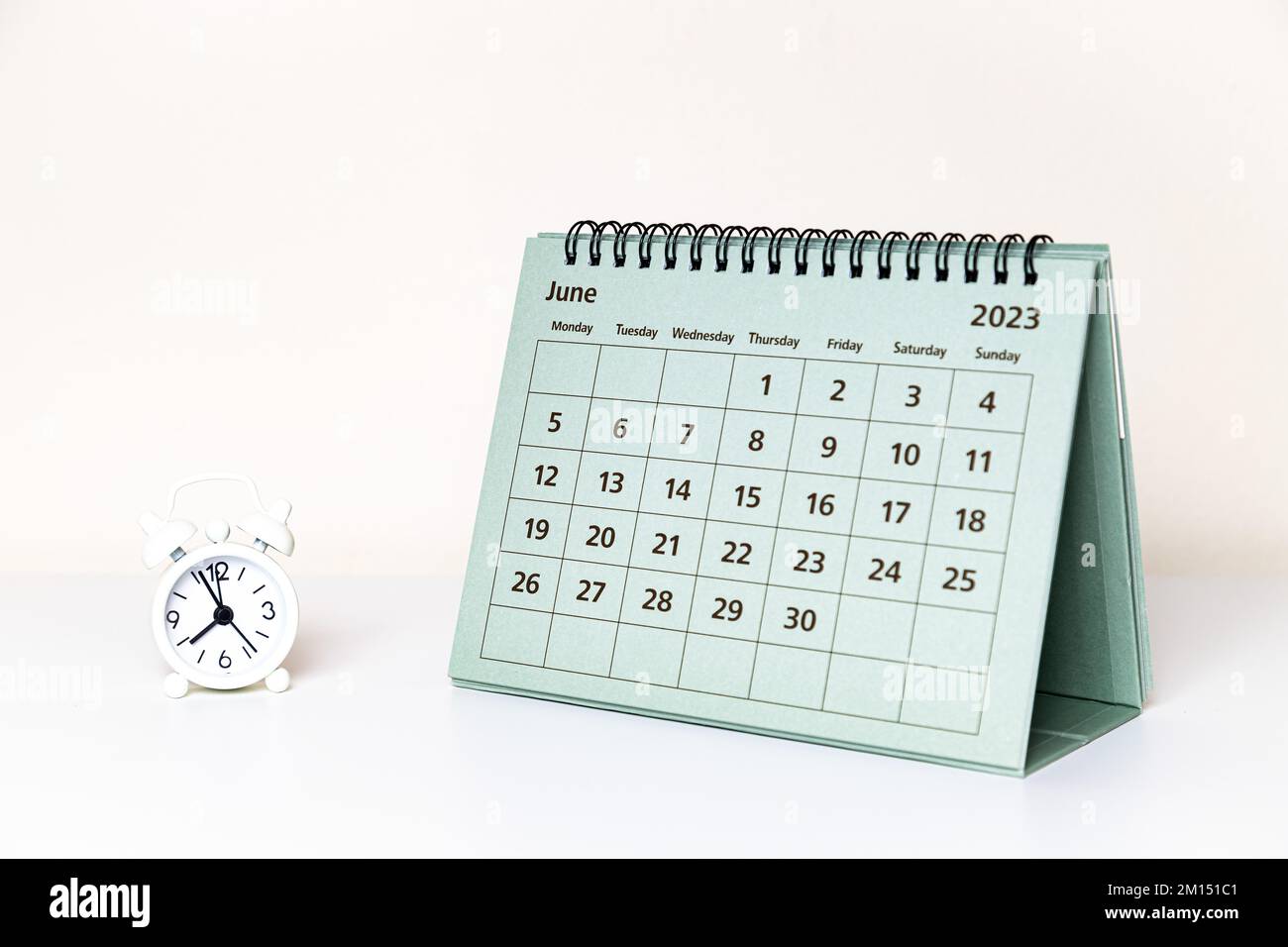 June 2023 calendar and small clock on white background isolated Stock ...