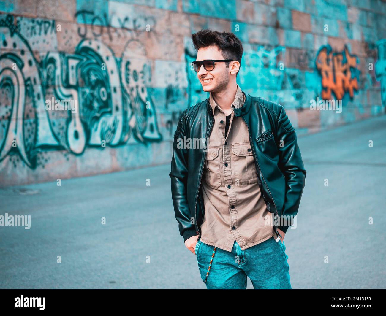 Man looking graffiti outside building hi-res stock photography and ...