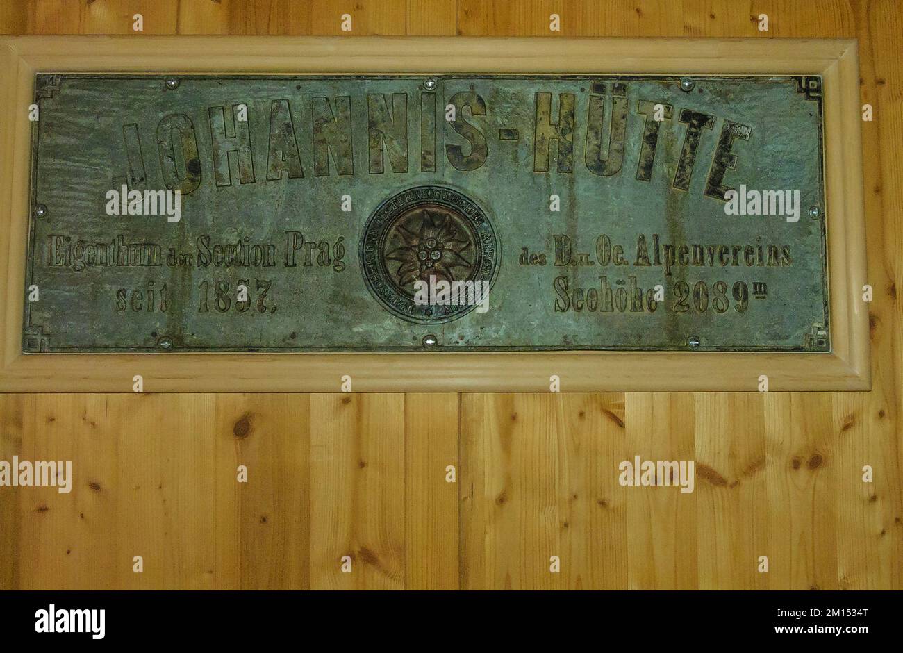 The image is of the original hut sign from 1857 at the German Alpine ...