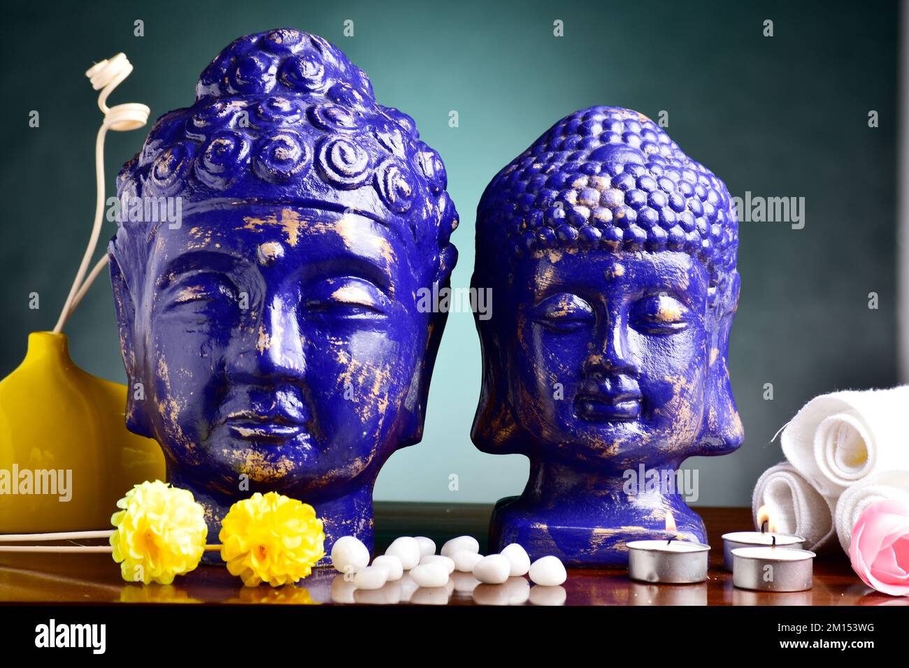 buddha statue with flowers and reed diffuser meditation decor Stock ...