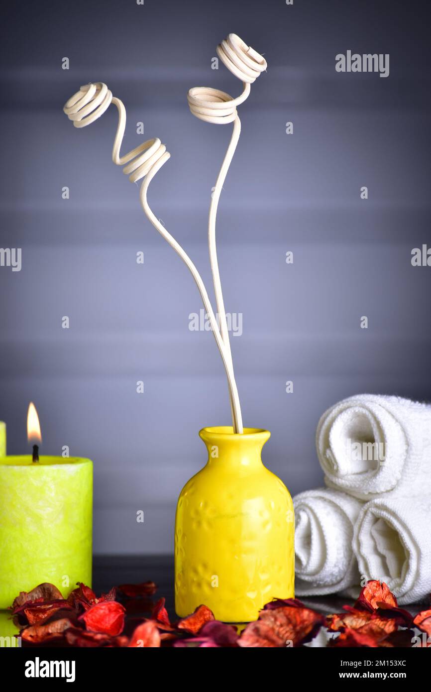 Aromatic reed diffuser with candles still life concept Stock Photo - Alamy
