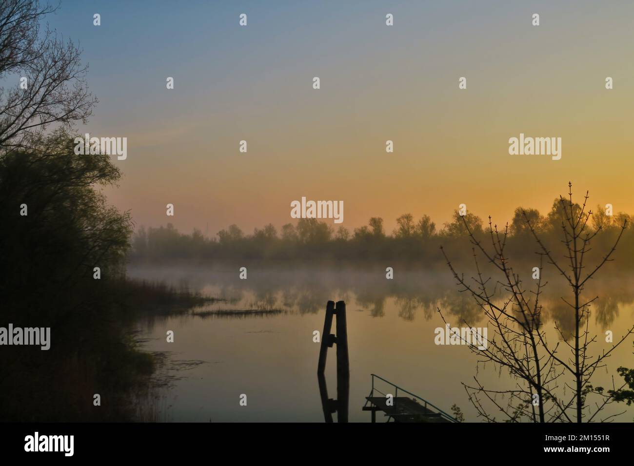 Sunrise over the river Warnow in the fog Stock Photo - Alamy
