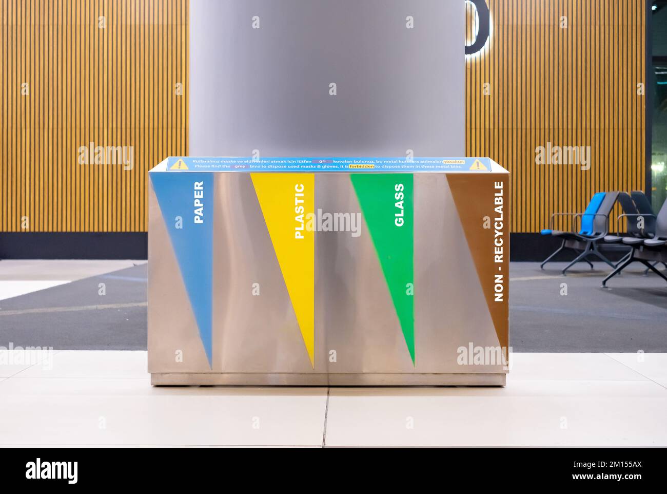 Recycle bin indoors. Metallic recycling bin standing in waiting room ...