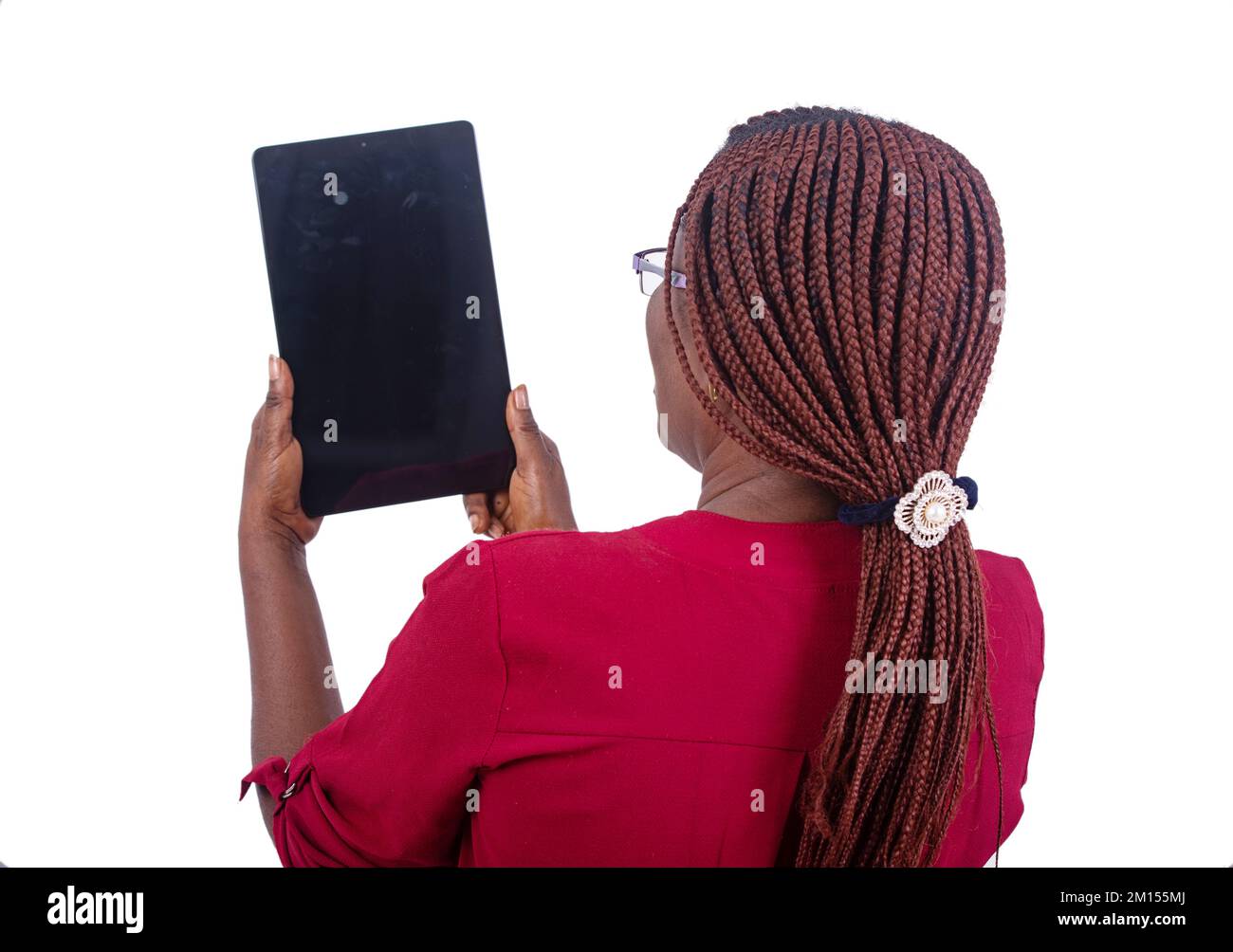 a beautiful businesswoman in glasses standing on a white background ...