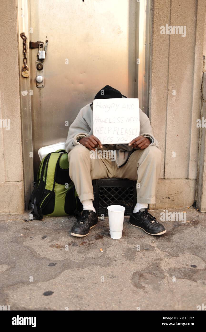 Homeless man siting in downtown of Chicago Stock Photo - Alamy