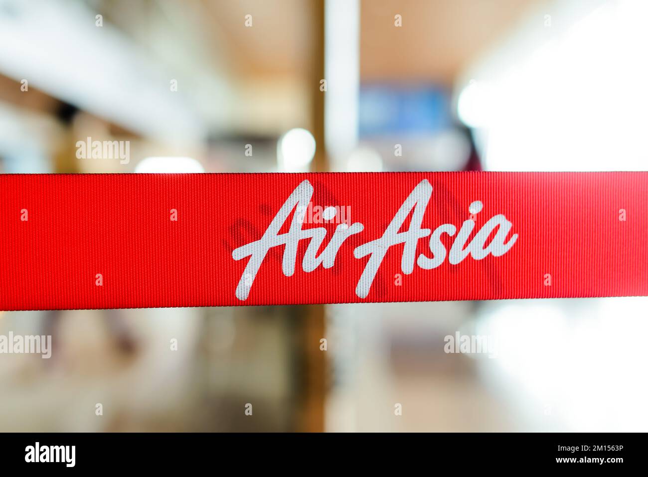 KUCHING - MAY 06: red tape with Airasia inscription on May 06, 2014 in ...
