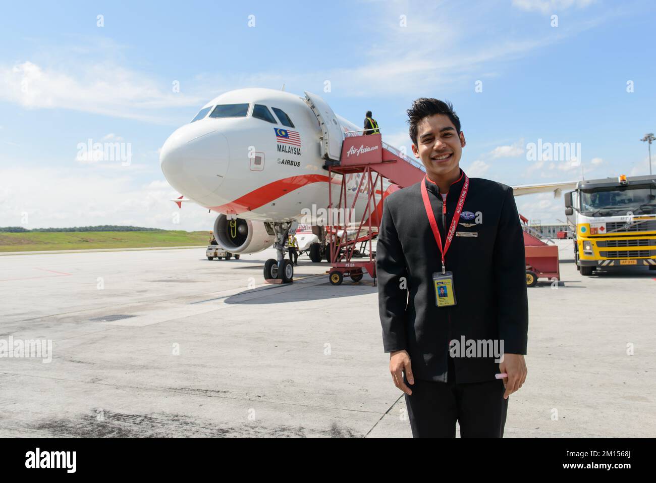 KUALA-LUMPUR - MAY 06: posint Airasia crew member on May 06, 2014 in ...