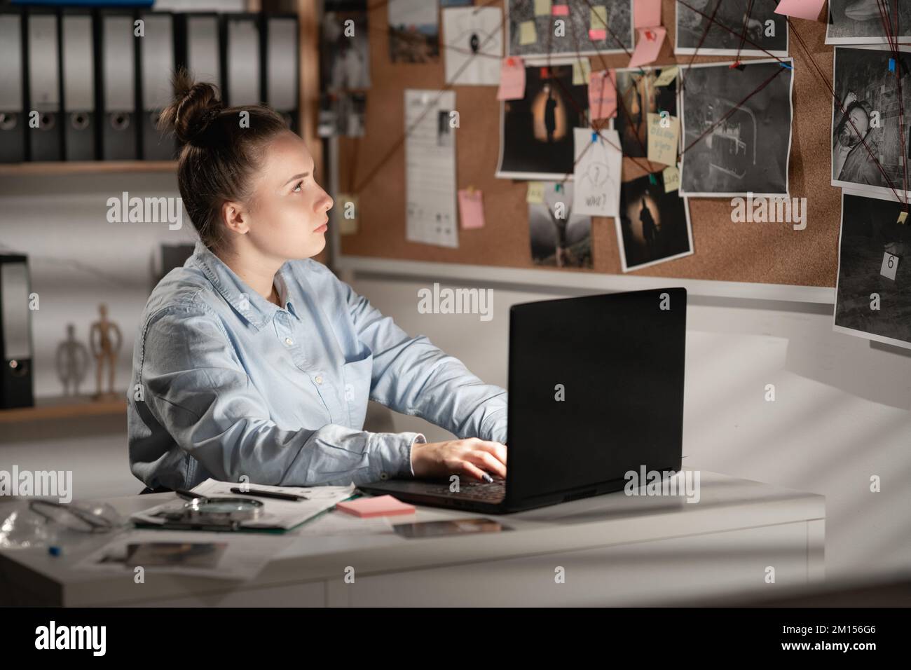 Private detective with laptop at work office, copy space Stock Photo ...