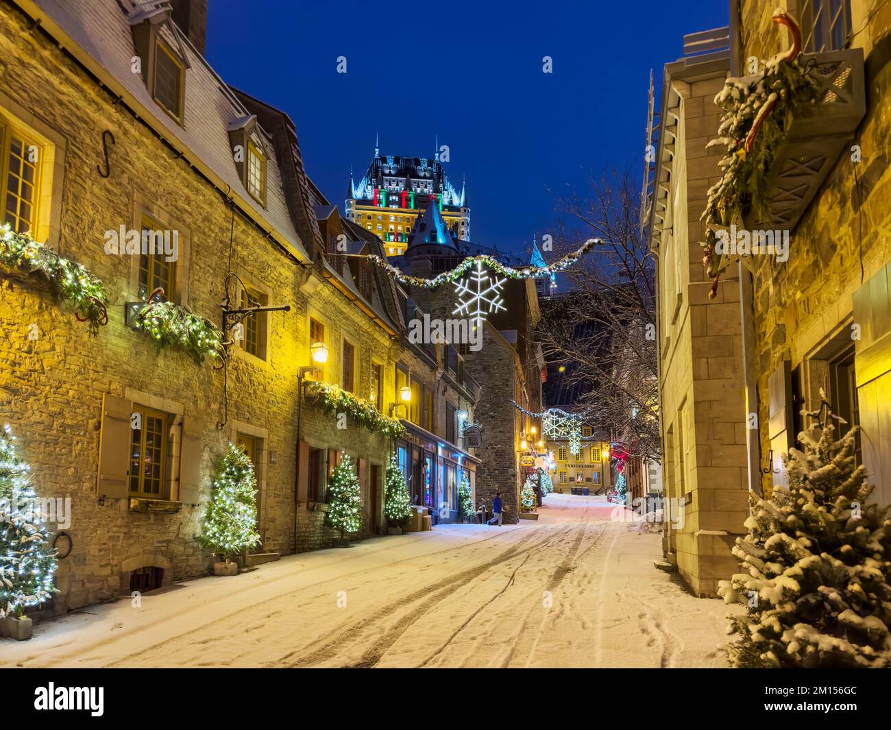 Snow in December in the festive decorated streets of Old Quebec City ...