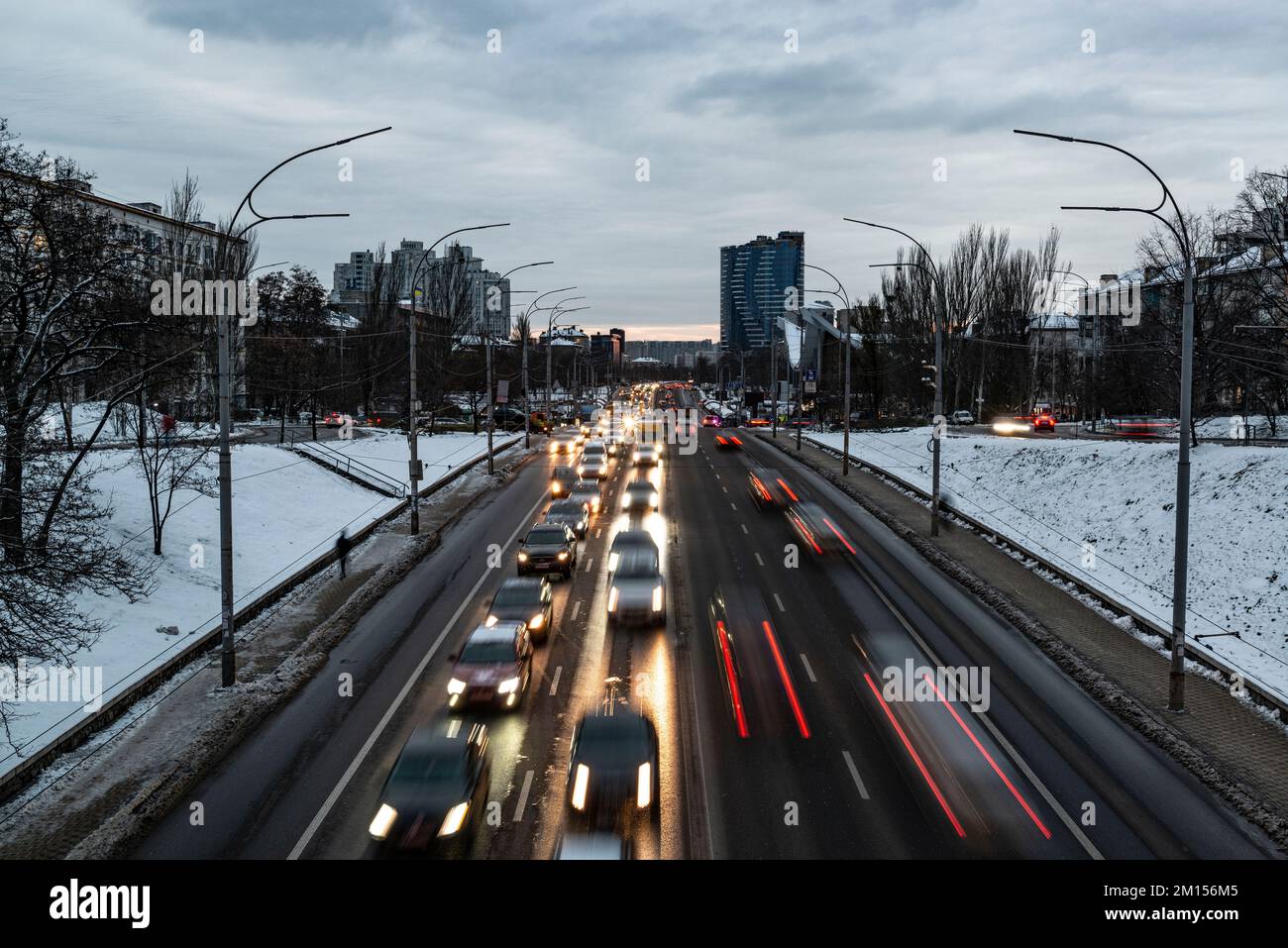 Road traffic in the Kyiv city. Car light traces on the highway in ...