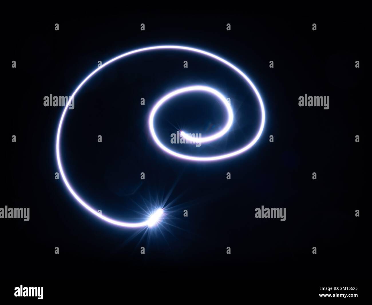 Magic blue light spirals on black background Stock Photo - Alamy