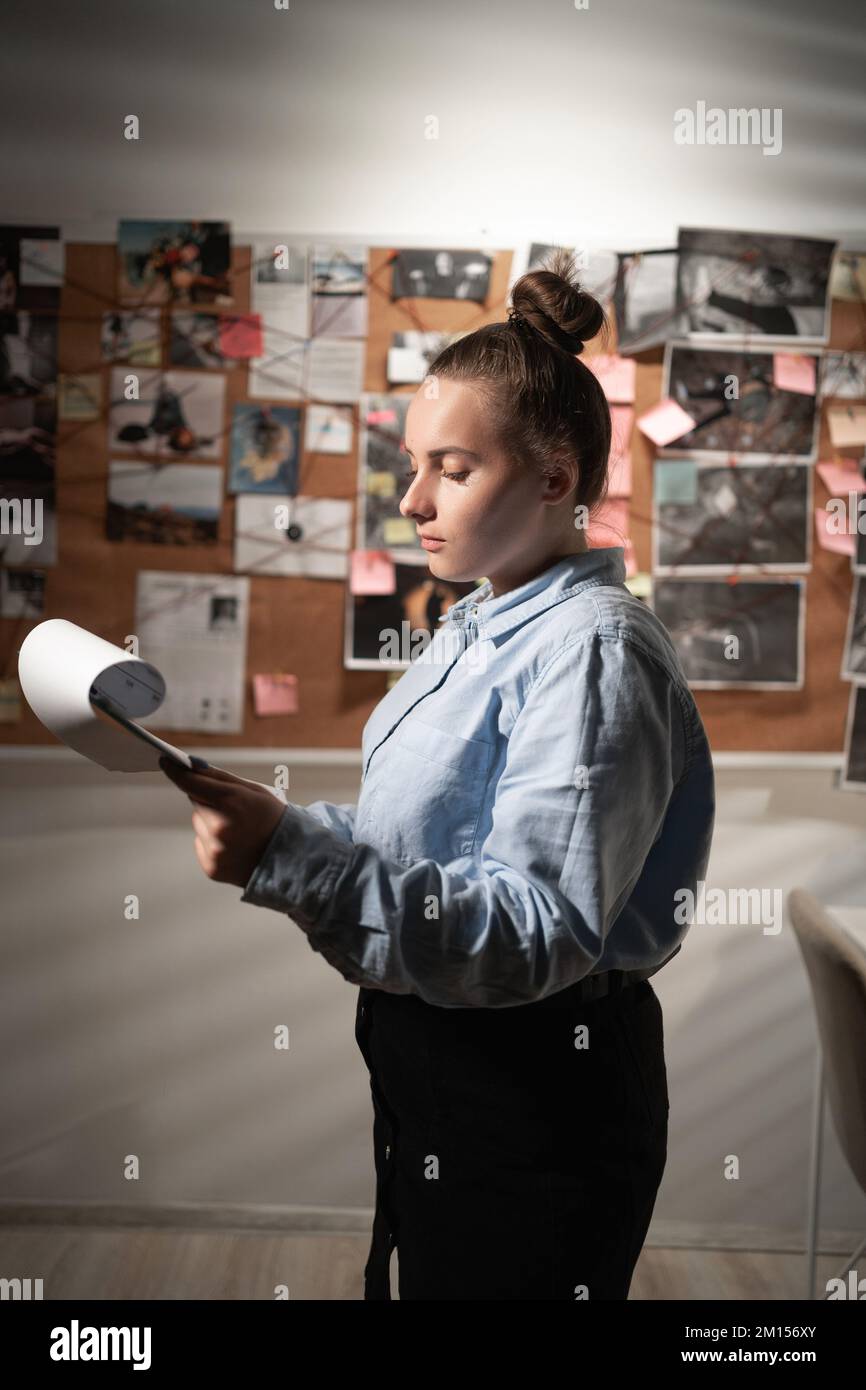Professional detective working documents hi-res stock photography and ...