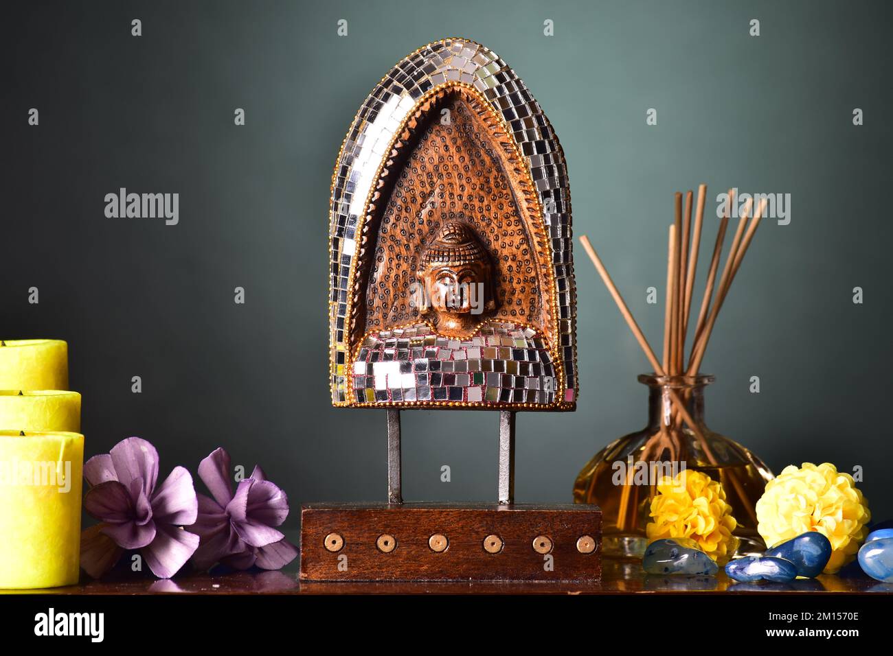 handcrafted wooden statue buddha with reed diffuser spa decor still ...
