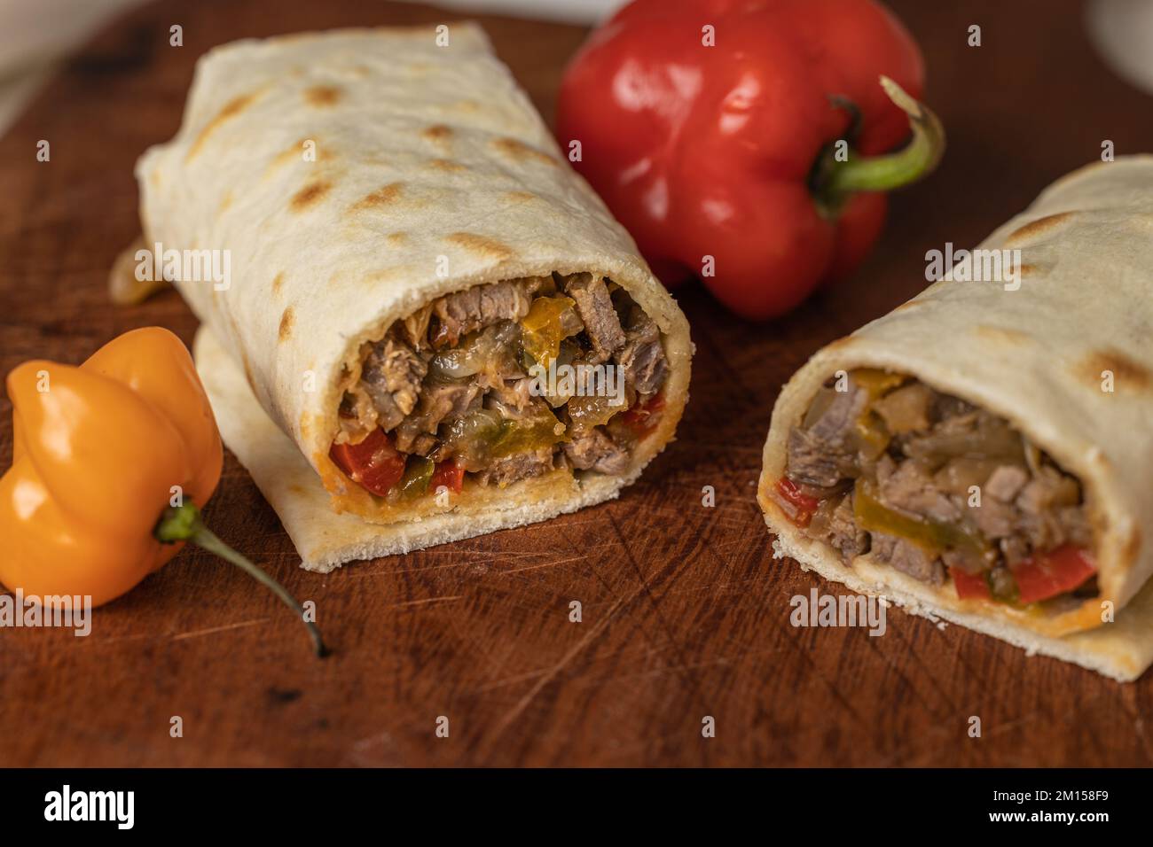 Close up of burritos, typical Mexican food, cut in half Stock Photo - Alamy