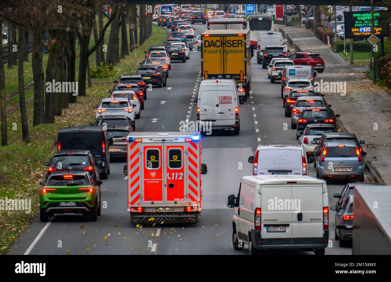 Emergency lane, ambulance making its way through city centre traffic ...