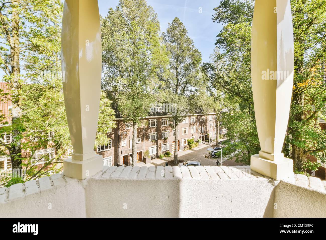 an outdoor area with trees and buildings in the background, taken from ...
