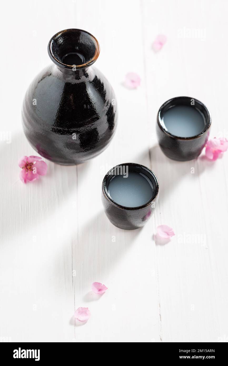 Unfiltered Japanese sake in the Japanese restaurant. Method of serving ...