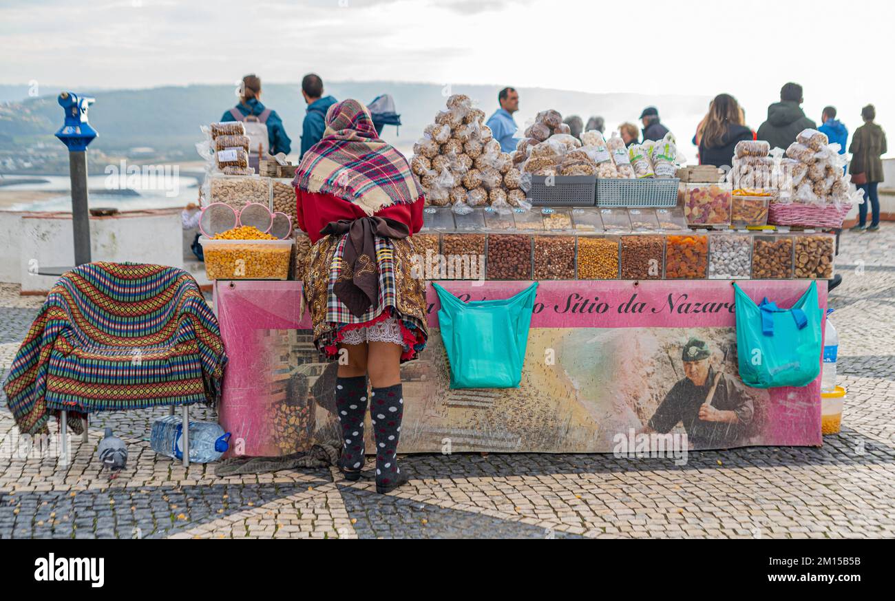 Nazare, Portugal - 09.12.2022: woman in traditional clothing selling ...