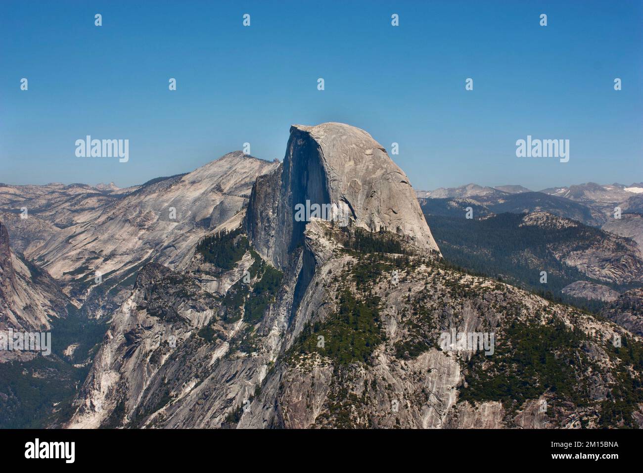 An aerial view of a mountain peak, and rocky mountain slope covered by ...