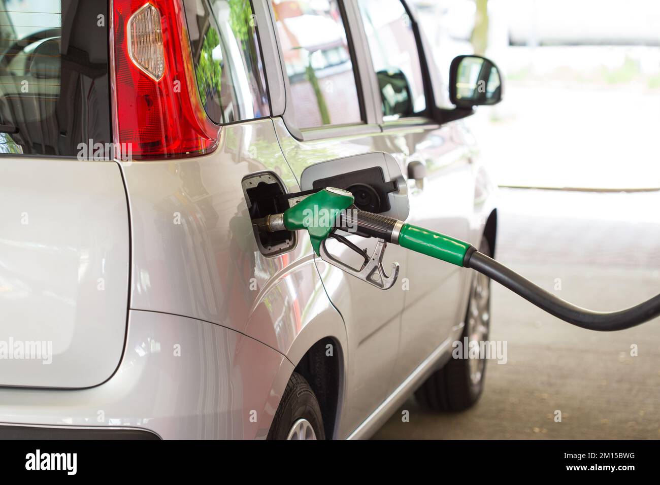 Close up of fuel pump nozzle inside the fuel filler of a car Stock ...