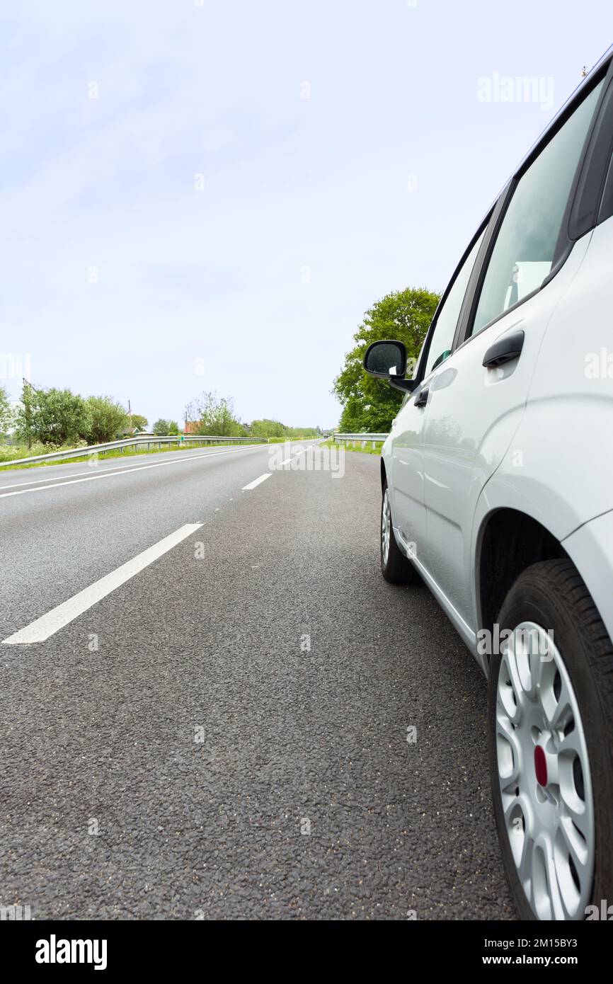 Rear ride view of a generic light color car Stock Photo - Alamy