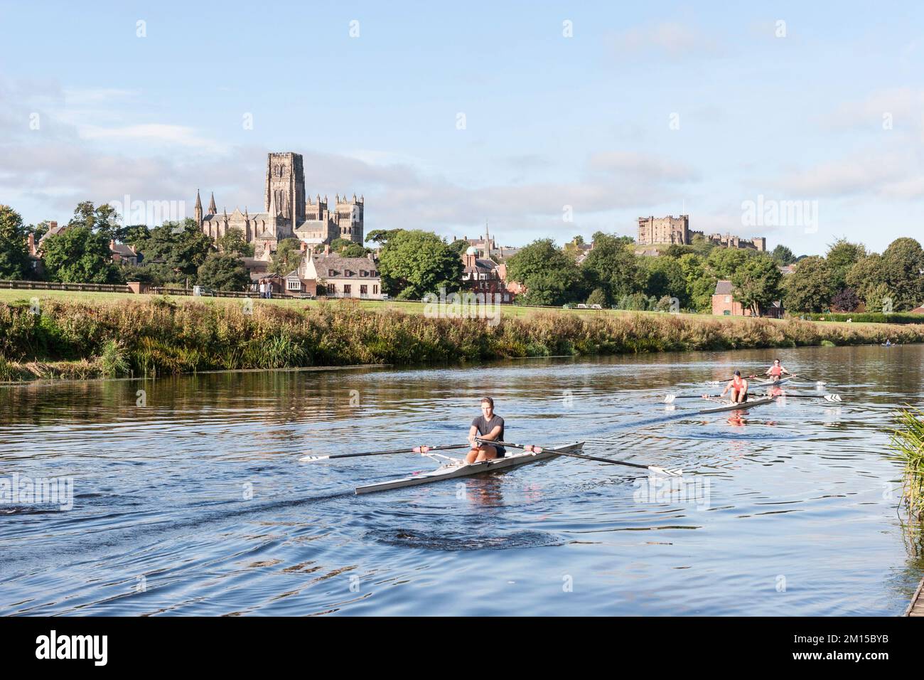 Members of a rowing club practising with sculls on the river Wear in ...