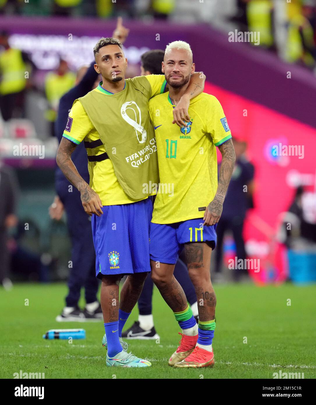 Brazil's Raphinha and Neymar (right) stand dejected after losing on ...