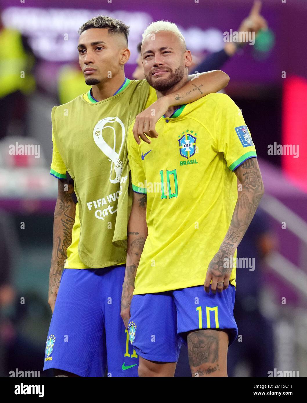 Brazil's Raphinha and Neymar (right) stand dejected after losing on ...