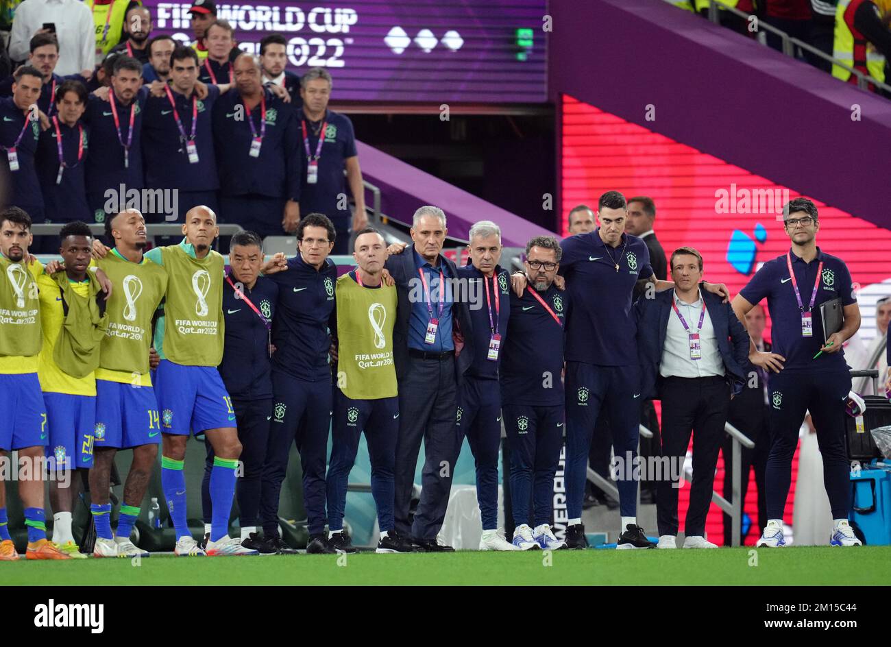 Brazil manager Tite (centre) stands with his back rooms staff and ...