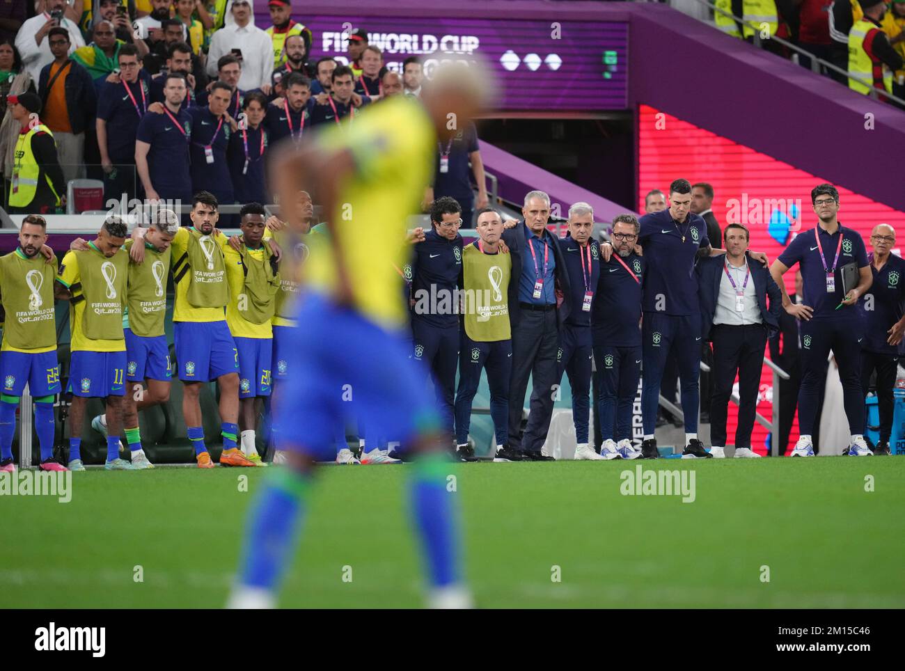 Brazil manager Tite (centre) stands with his back rooms staff and ...