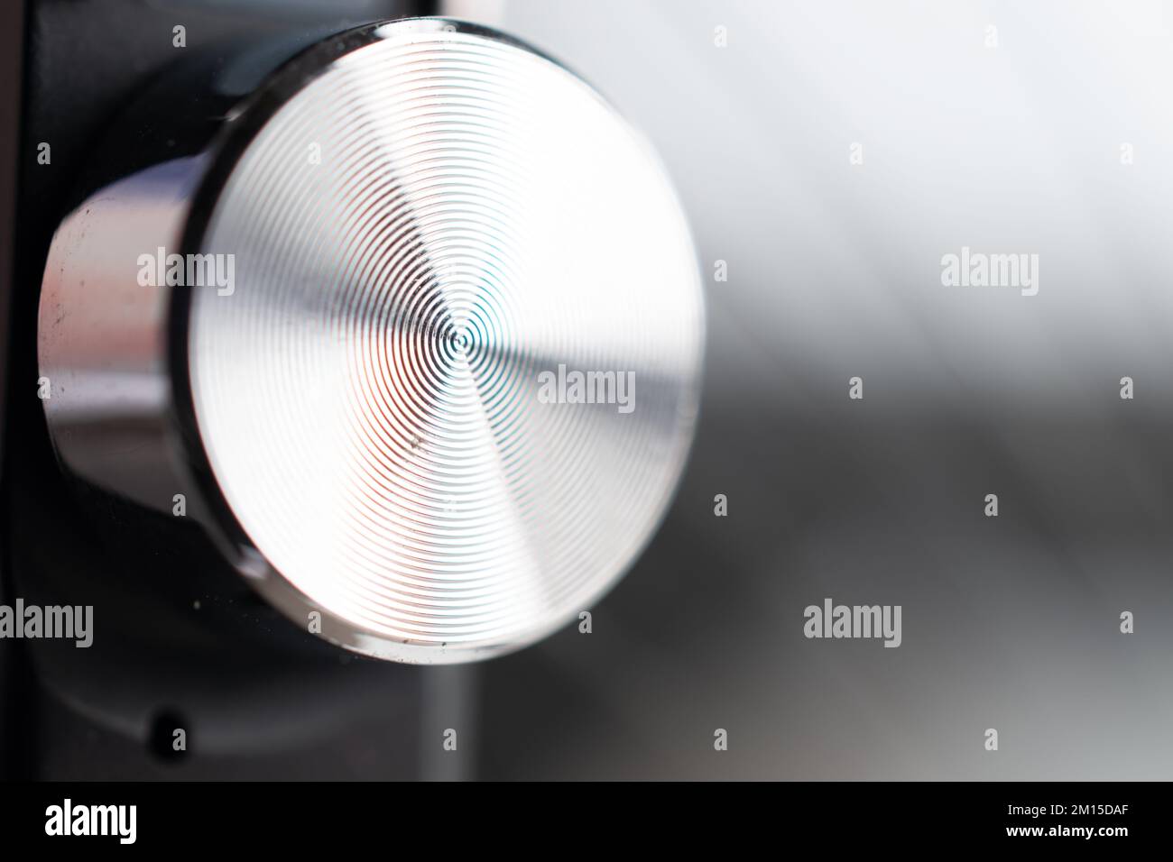 Volume controller knob on music player Stock Photo - Alamy