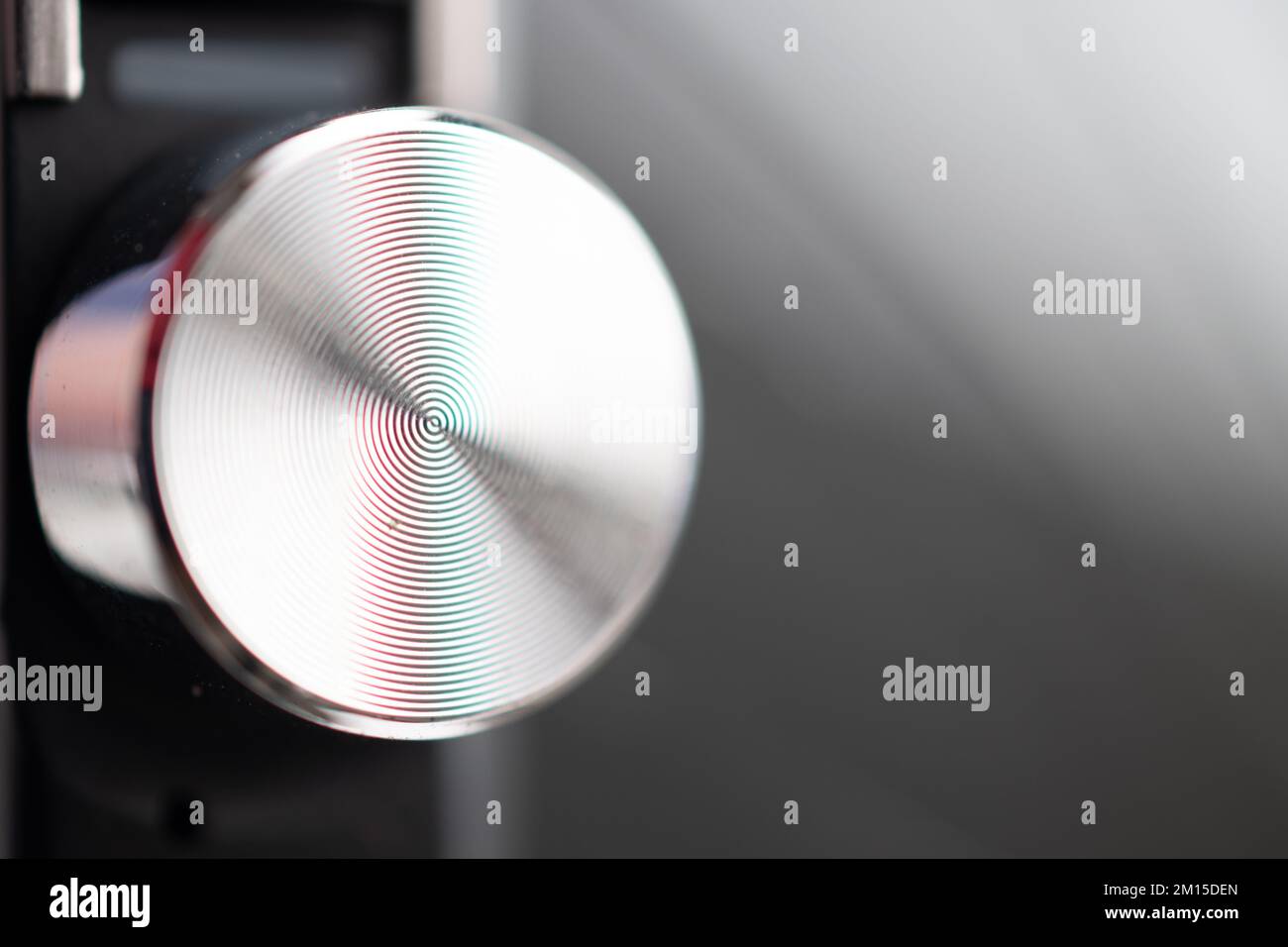 Metal volume knob on music system Stock Photo - Alamy