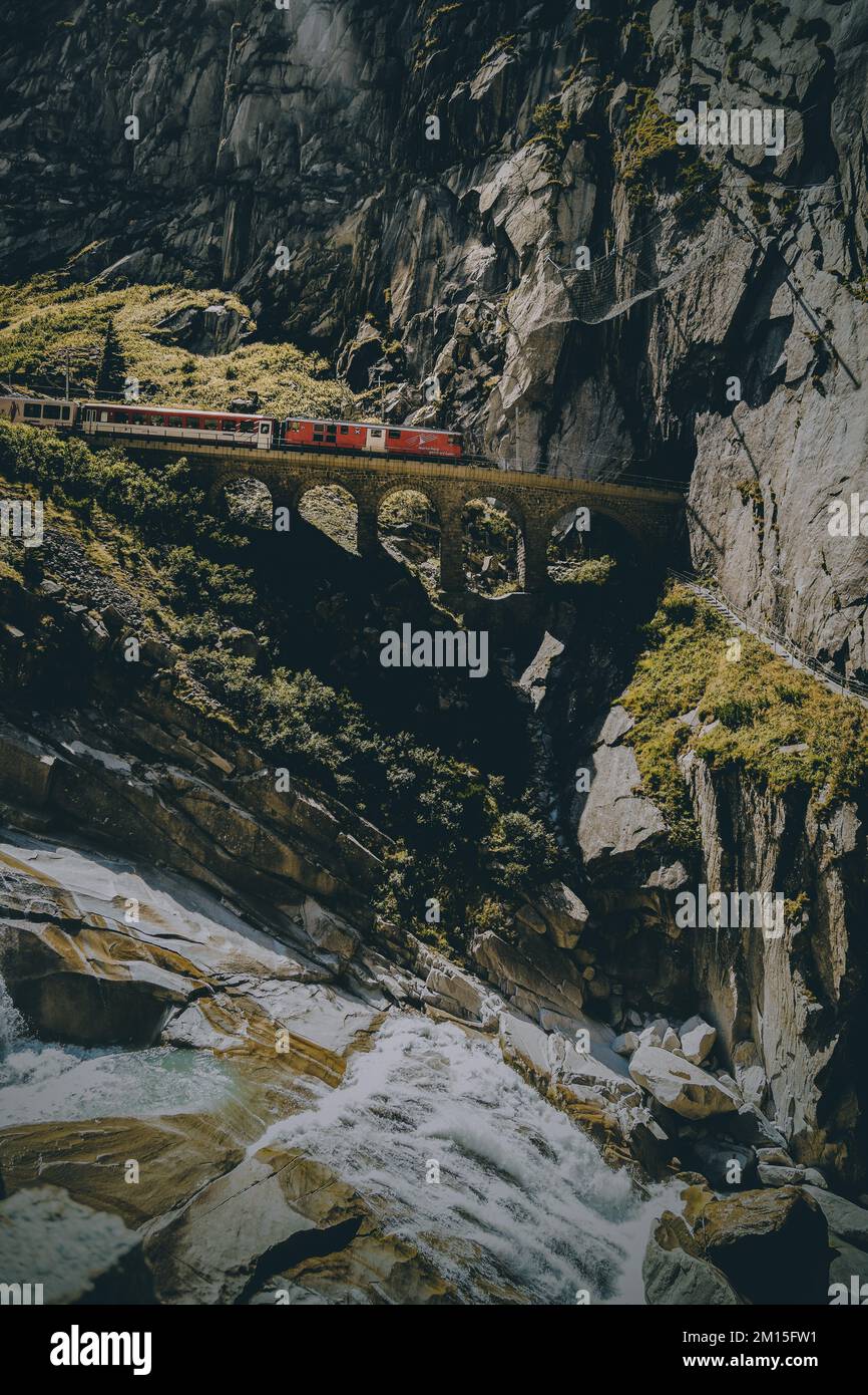 A vertical landscape of the beautiful green Gotthard Pass mountain pass ...