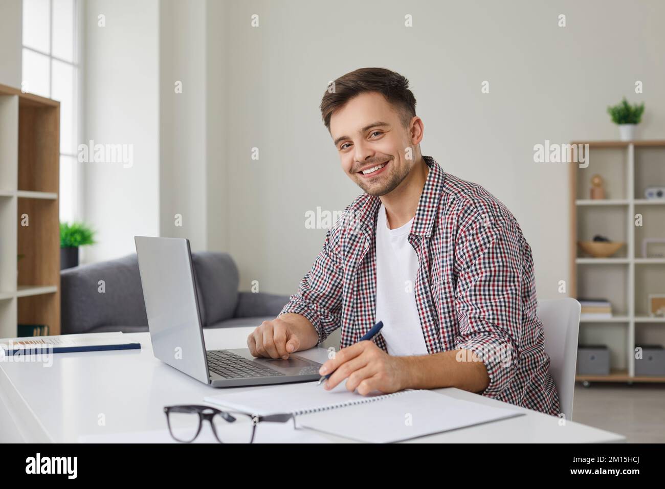 Man laptop cheerful table smile hi-res stock photography and images - Alamy