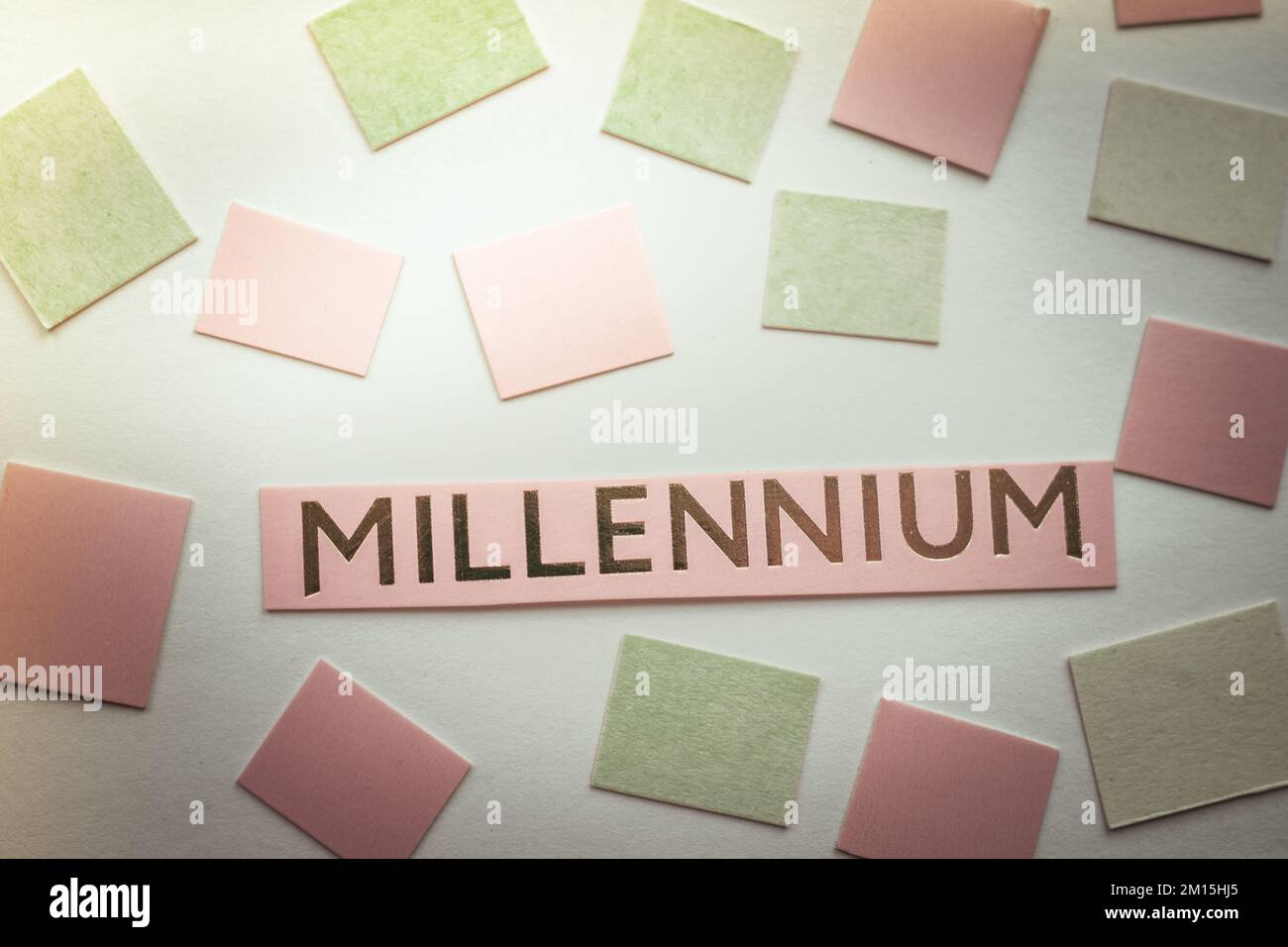 Small paper sheets and paper with millennium text on gray table Stock ...