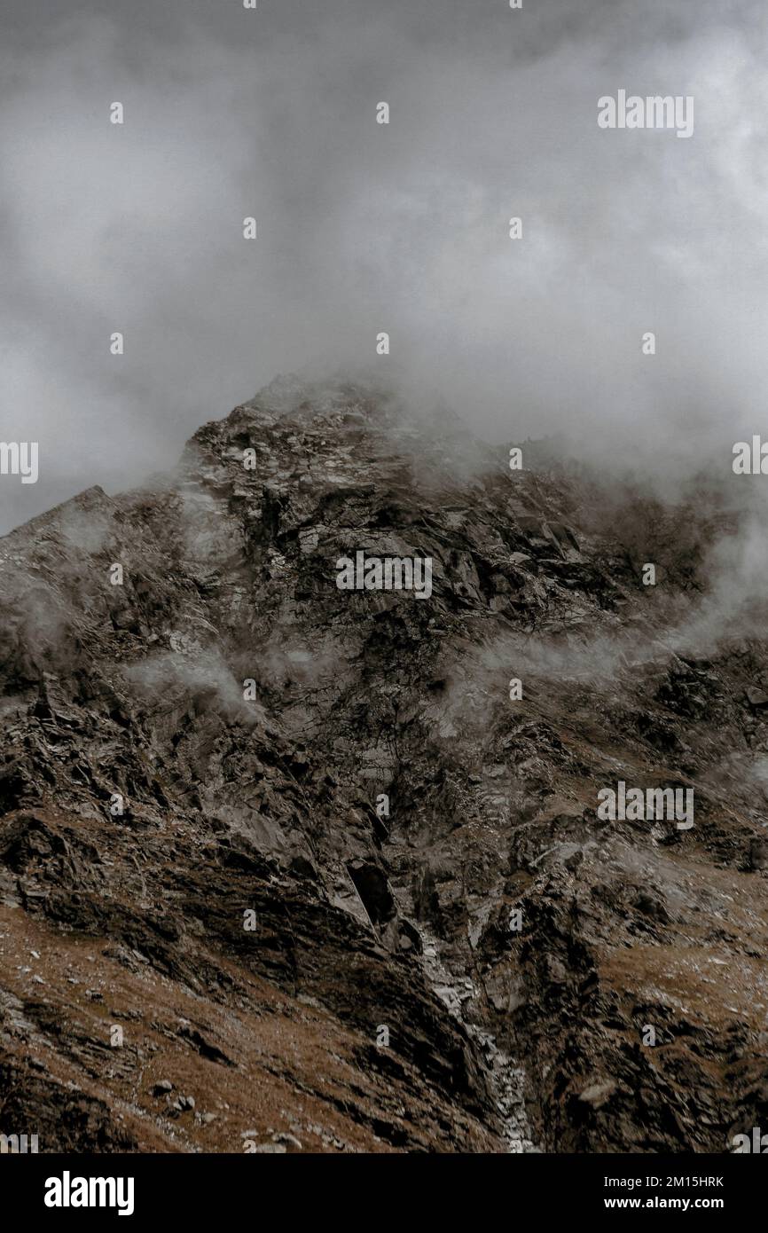 A vertical aerial landscape of the rocky hill San Bernardino covered in ...