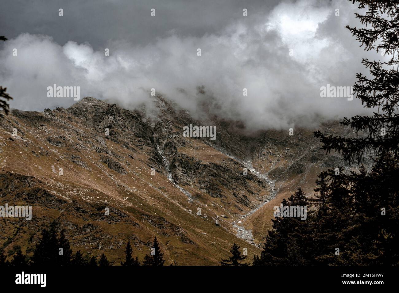 An aerial landscape of the rocky hill San Bernardino covered in dark ...
