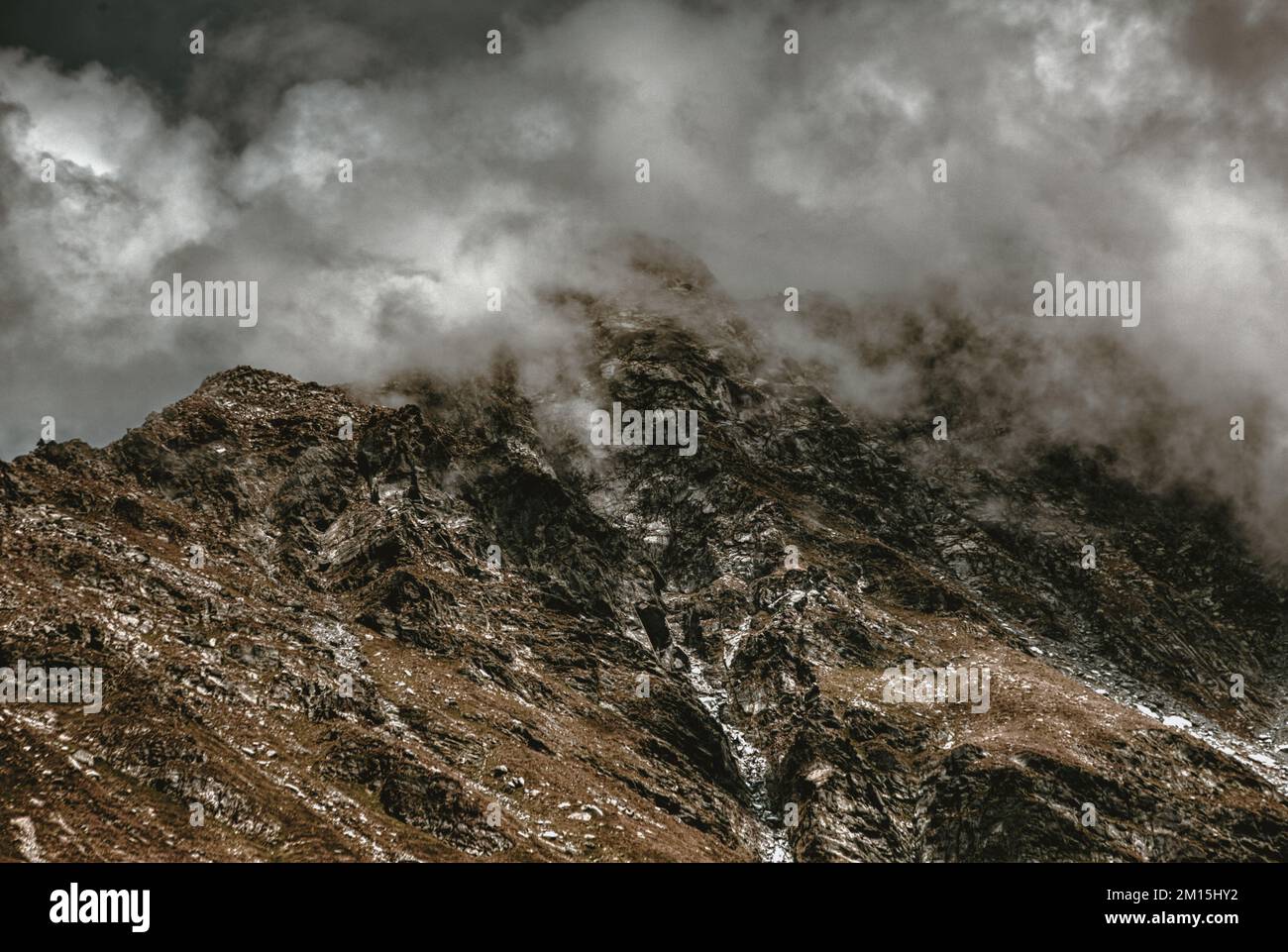 An aerial landscape of the rocky hill San Bernardino covered in dark ...