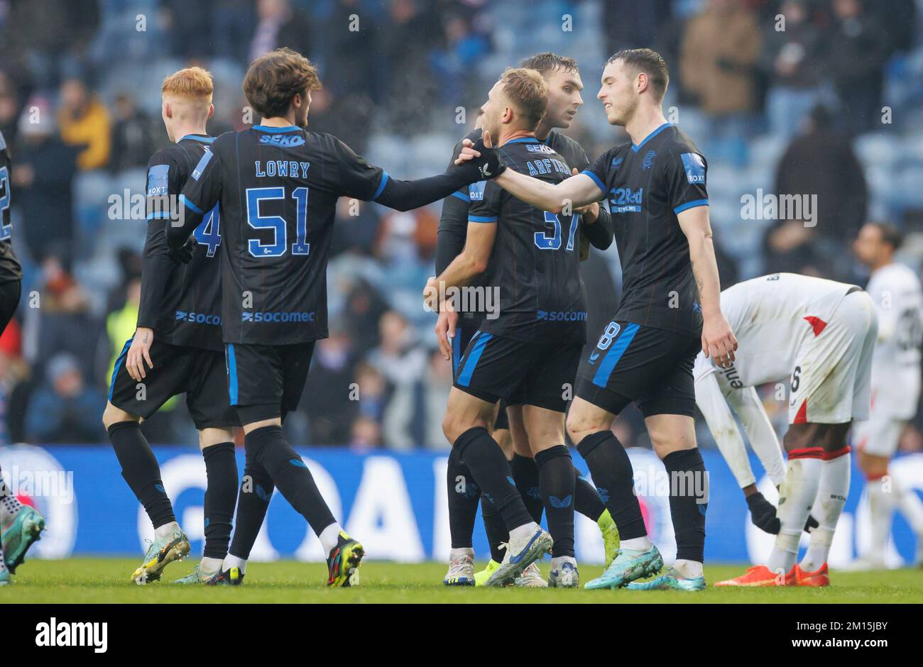 Rangers Leon King with Alex Lowry after the friendly match at the Ibrox ...