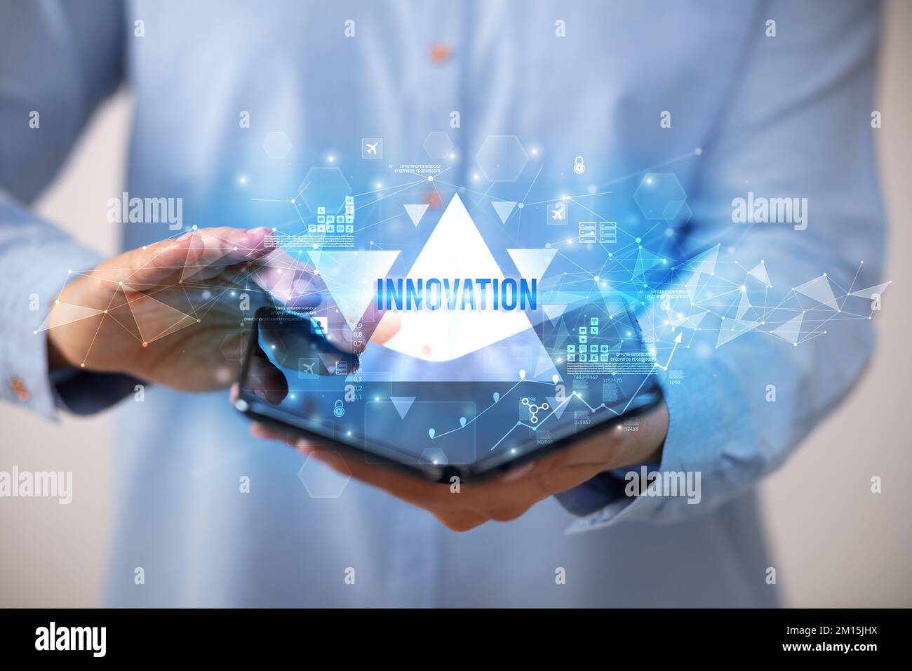 Businessman holding a foldable smartphone, business concept Stock Photo ...