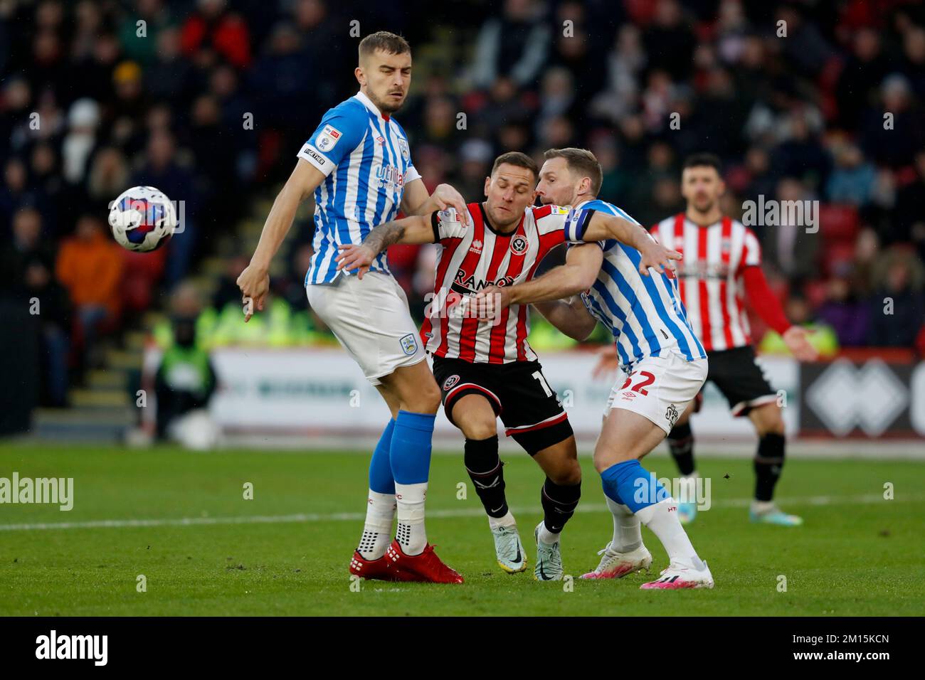 Sheffield United's Billy Sharp (centre), Huddersfield Town's Duane ...