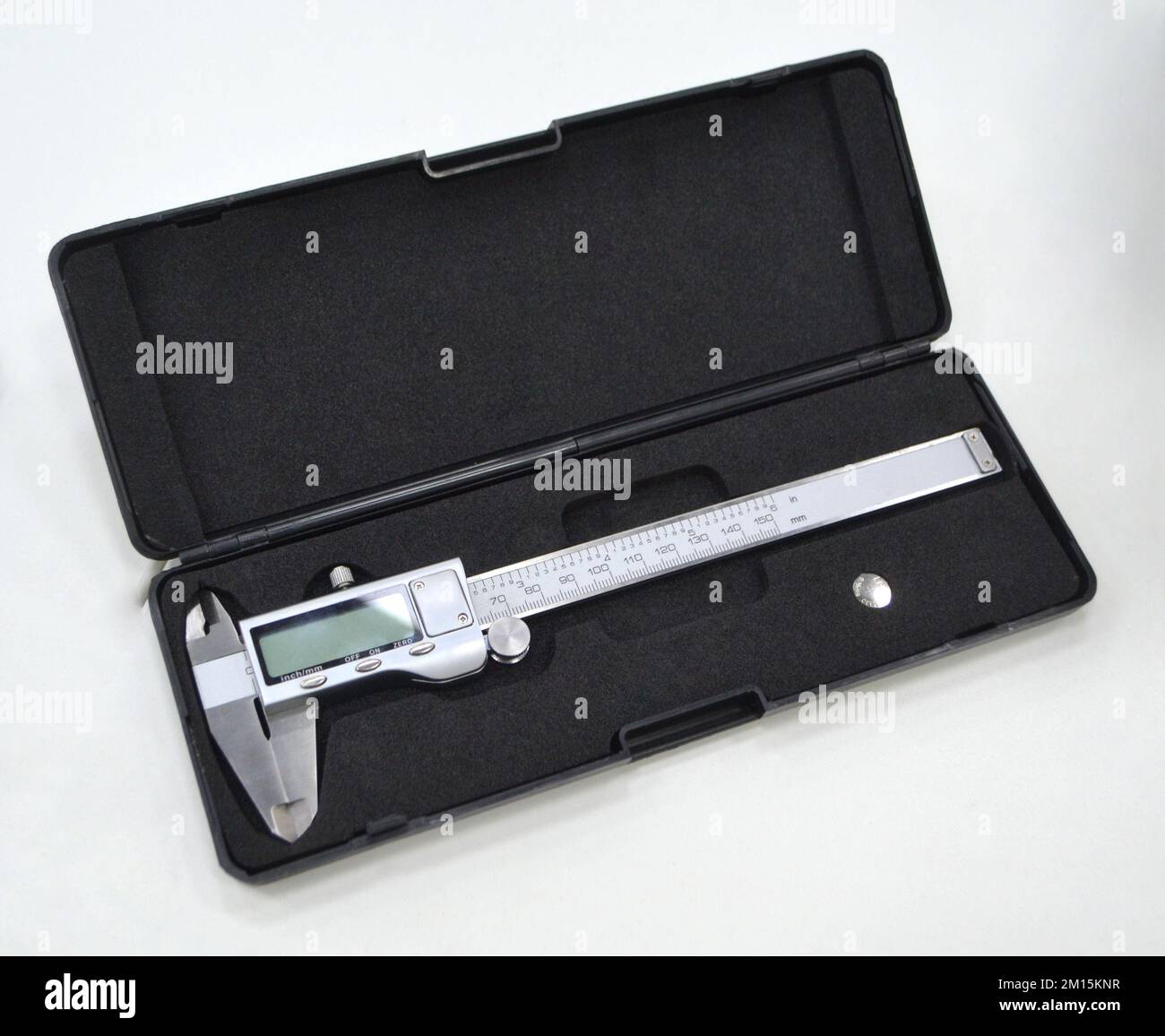 Digital electronic vernier caliper in plastic black box isolated on ...