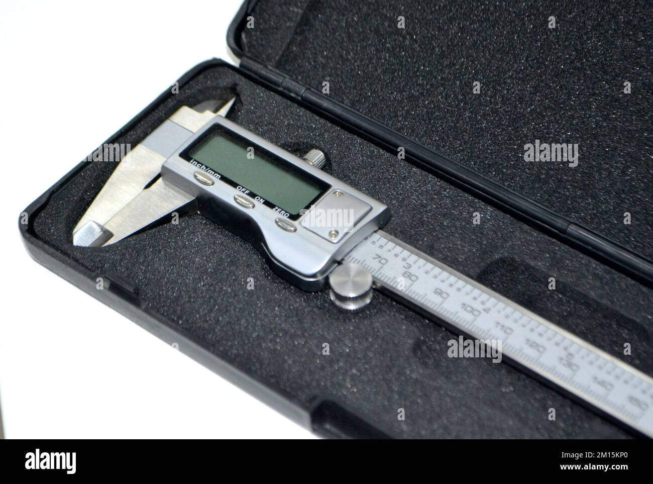 Digital electronic vernier caliper in plastic black box isolated on ...