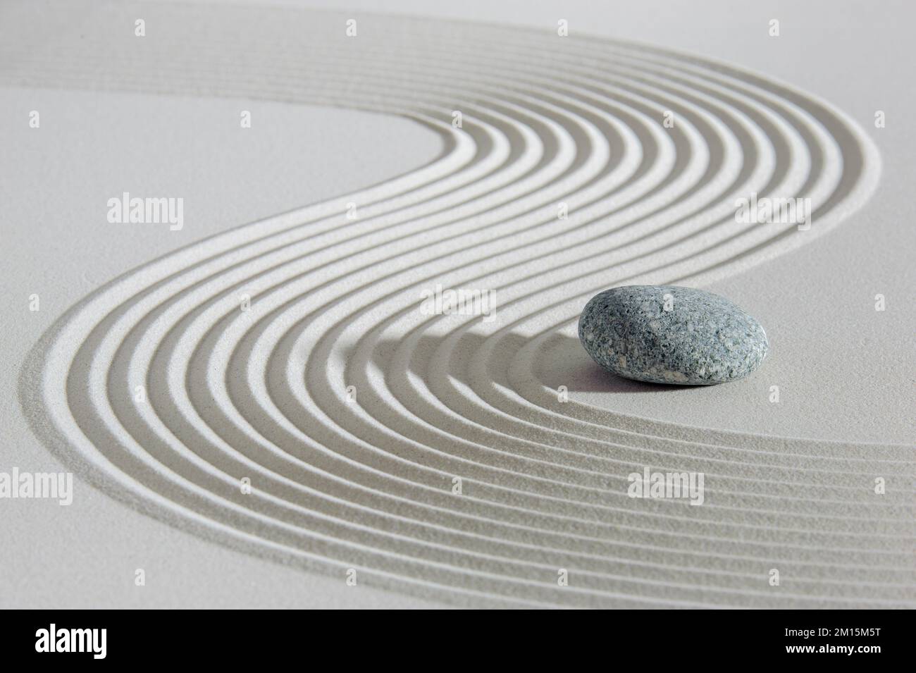 Japanese Zen garden with stone in textured sand Stock Photo - Alamy
