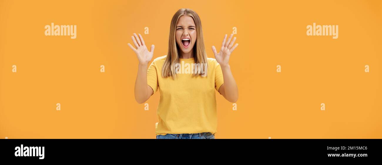 Woman releasing stress yelling with joy and pleasure gesturing with ...