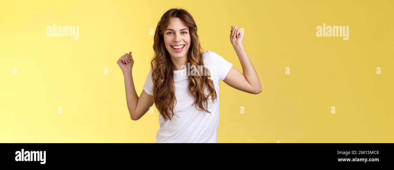 Oh yes check out my moves. Cheeky stylish good-looking young woman ...