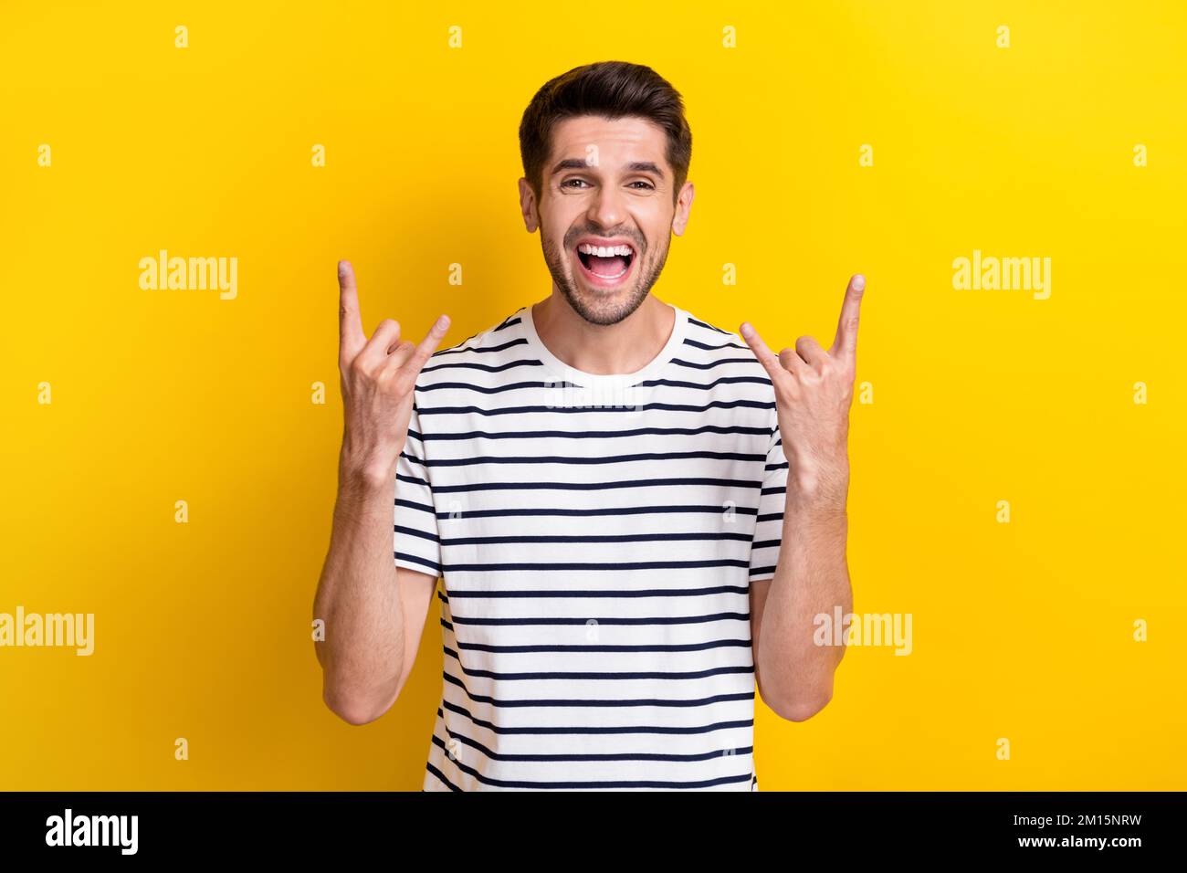 Portrait of carefree positive person arms demonstrate heavy metal ...